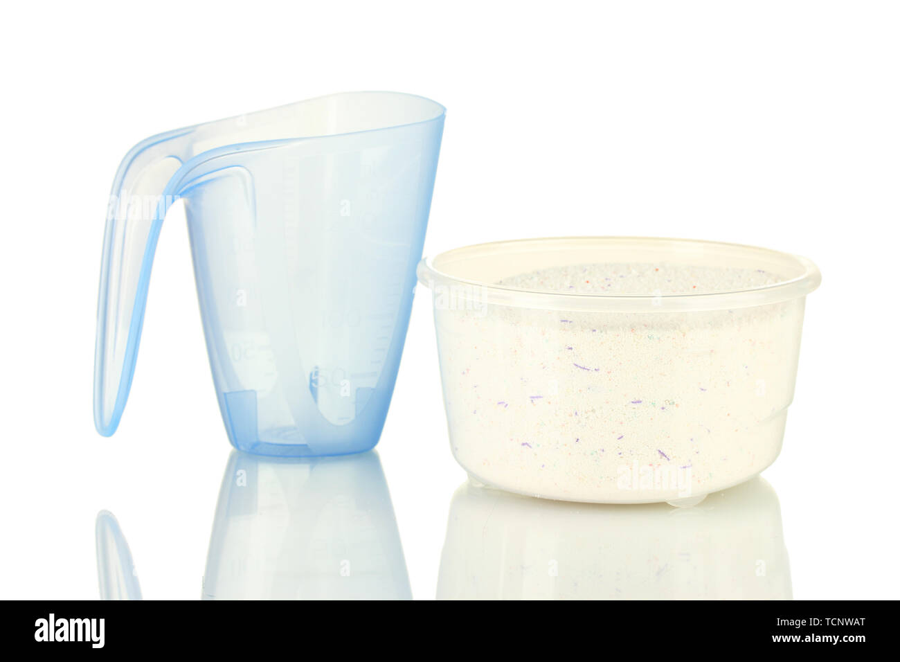 washing powder in a measuring cups, isolated on white Stock Photo - Alamy