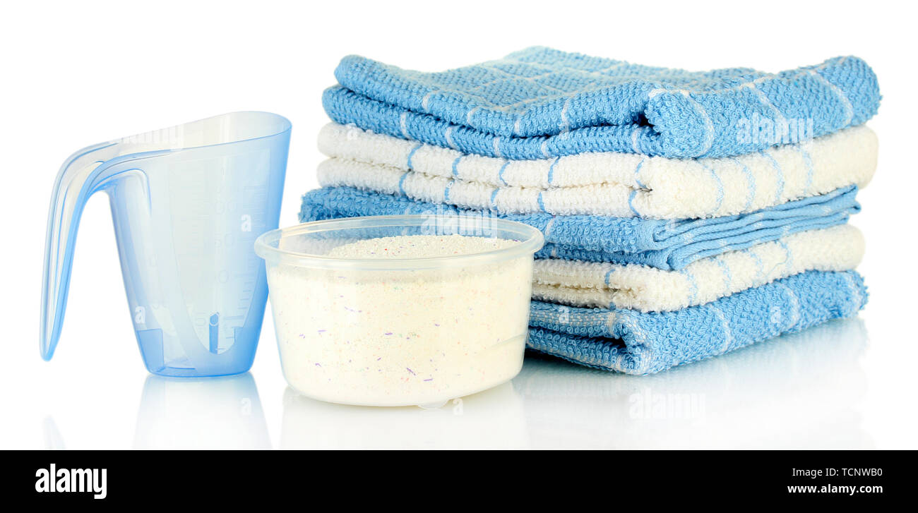 measuring cups with washing powder and towels, isolated on white Stock ...