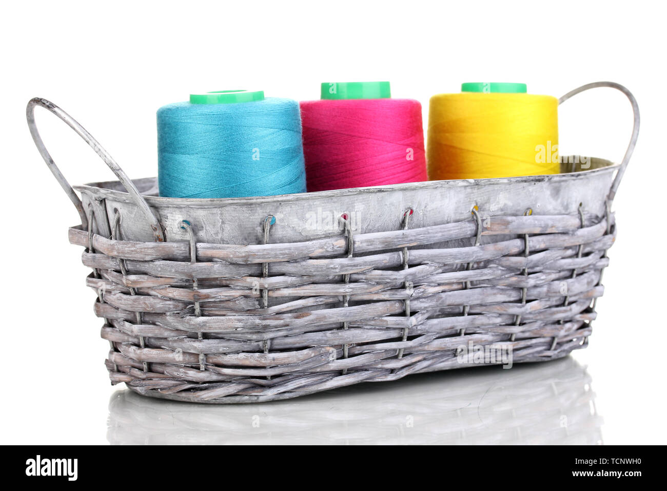 Bright threads in basket isolated on white Stock Photo - Alamy