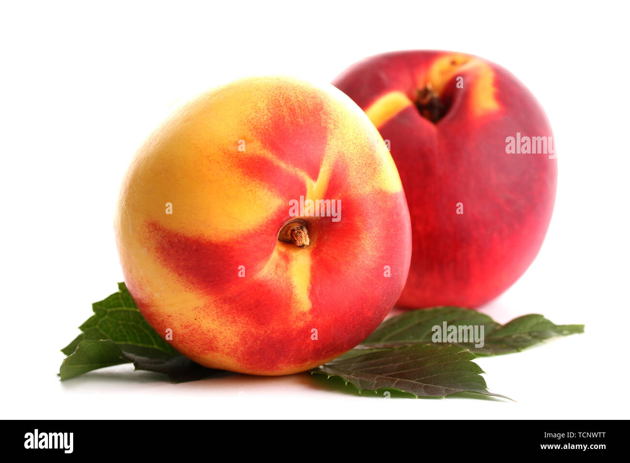 Nectarines with green leaf Cut Out Stock Images & Pictures - Alamy
