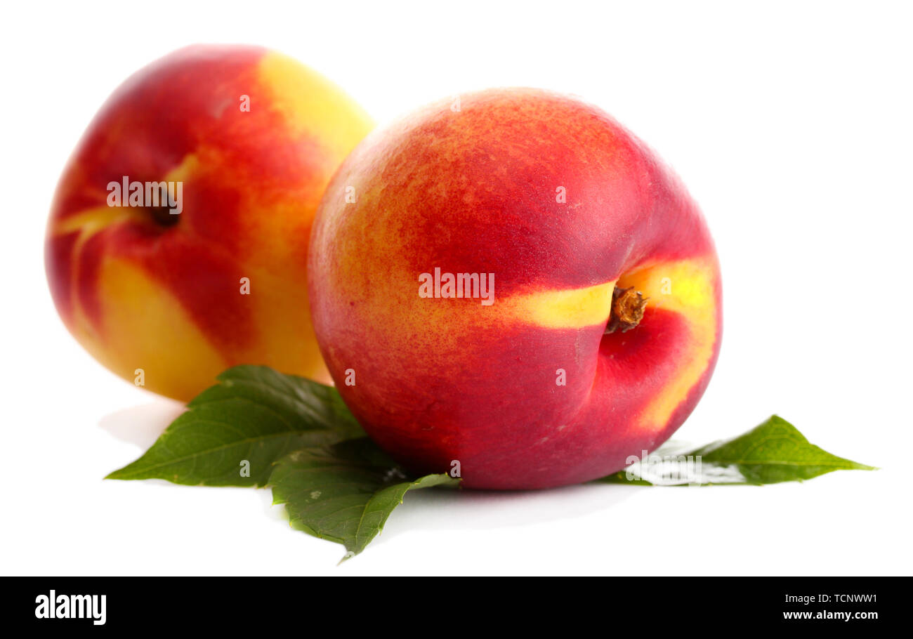 Nectarines with green leaf Cut Out Stock Images & Pictures - Alamy