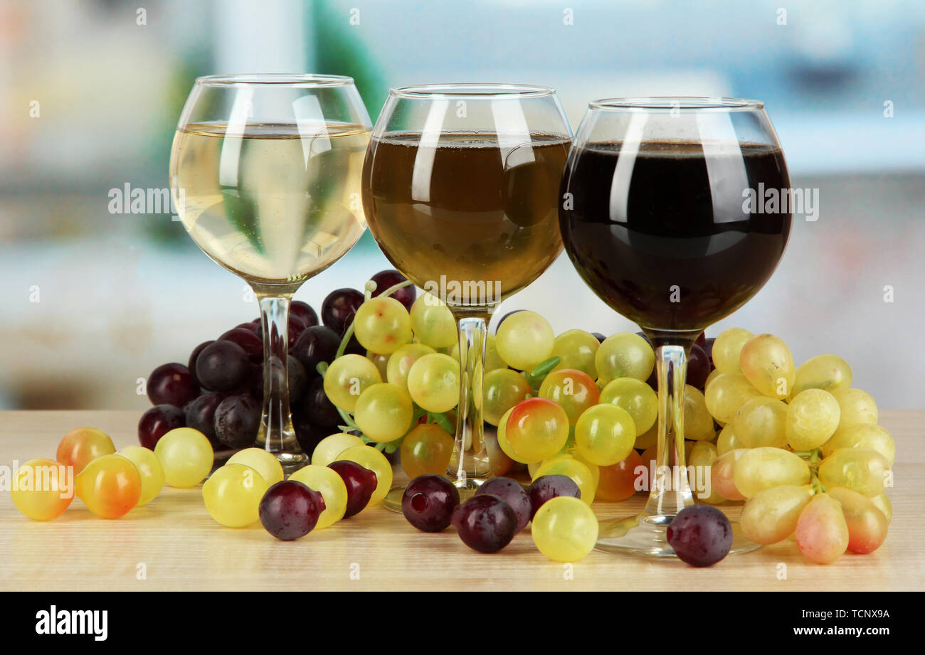 White, pink and red wine in glass on room background Stock Photo - Alamy