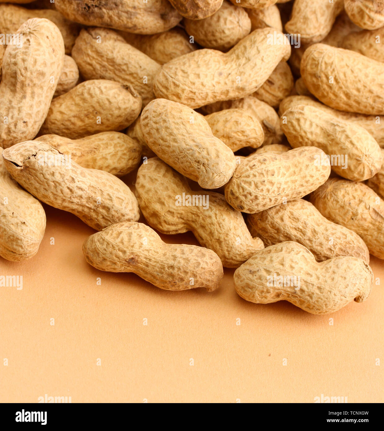 tasty peanuts, on beige background Stock Photo - Alamy