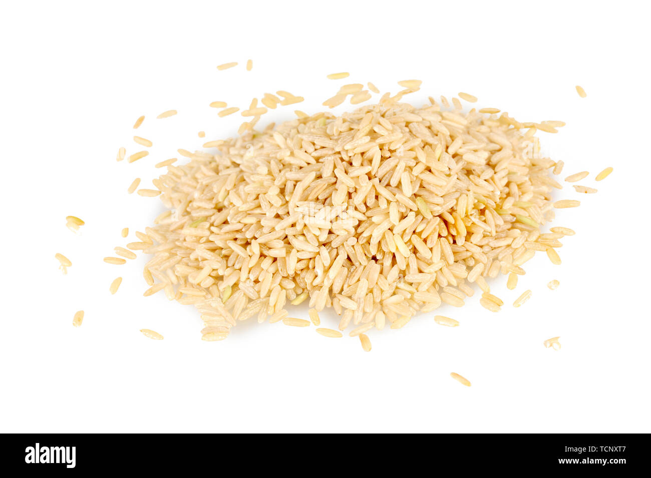 brown rice uncooked in a heap isolated on a white background Stock ...