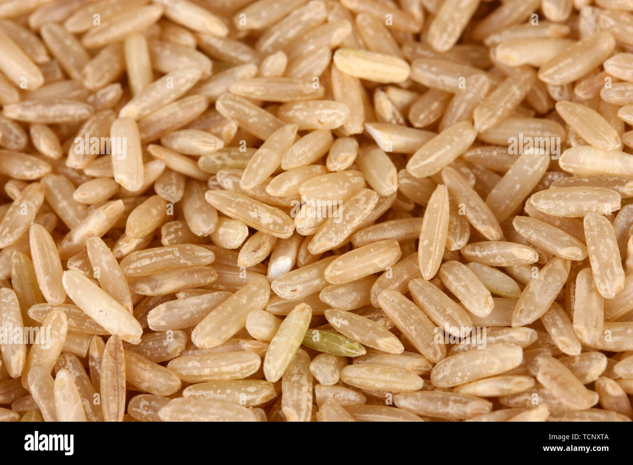 Background brown rice Stock Photo - Alamy