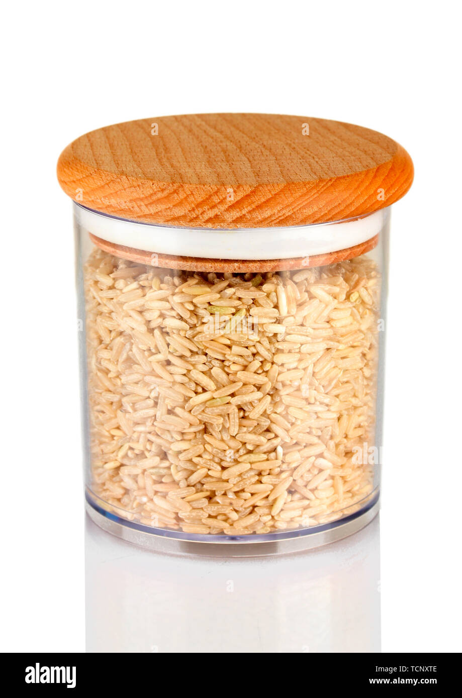 brown rice in jar on white background Stock Photo - Alamy