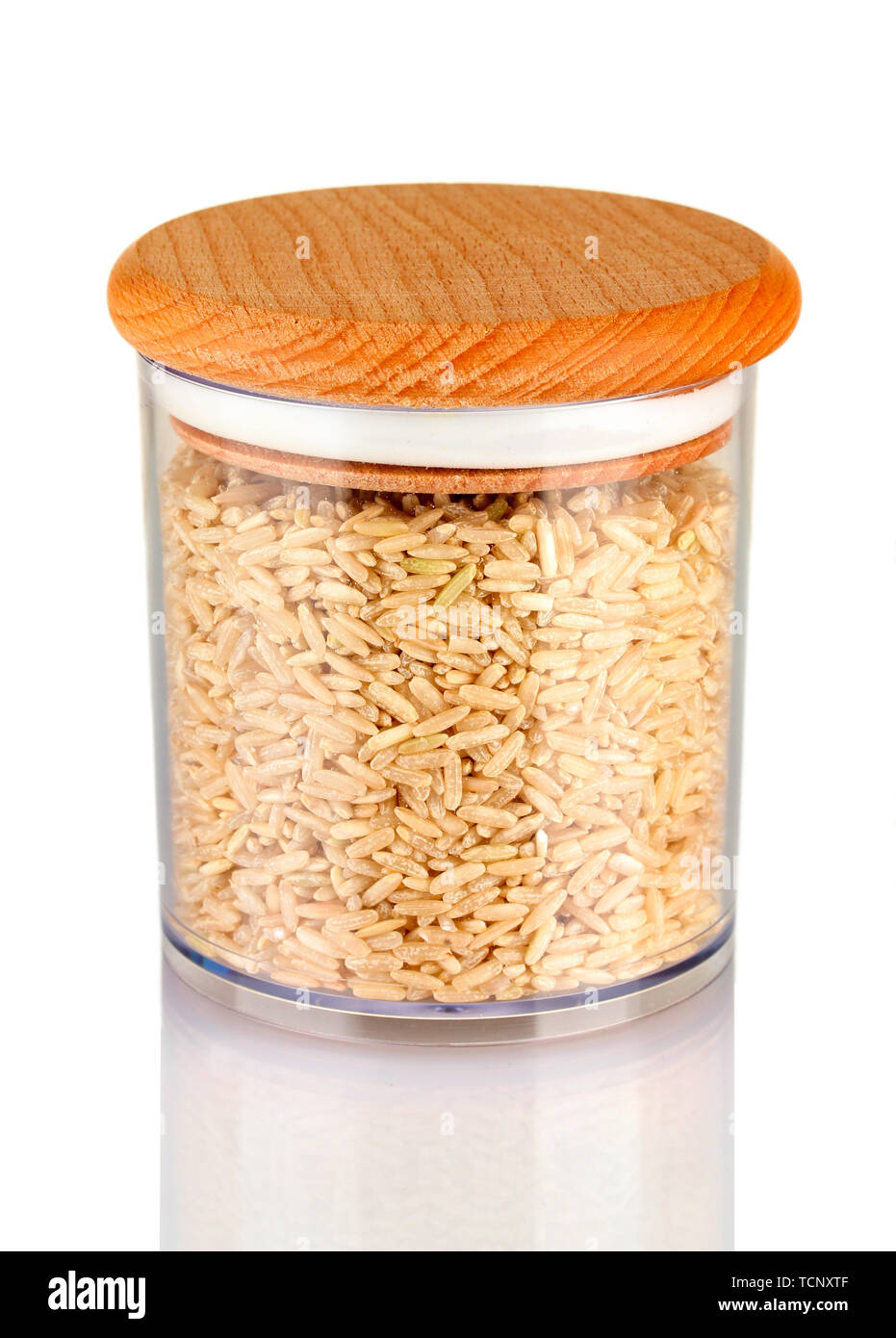 brown rice in jar on white background Stock Photo - Alamy