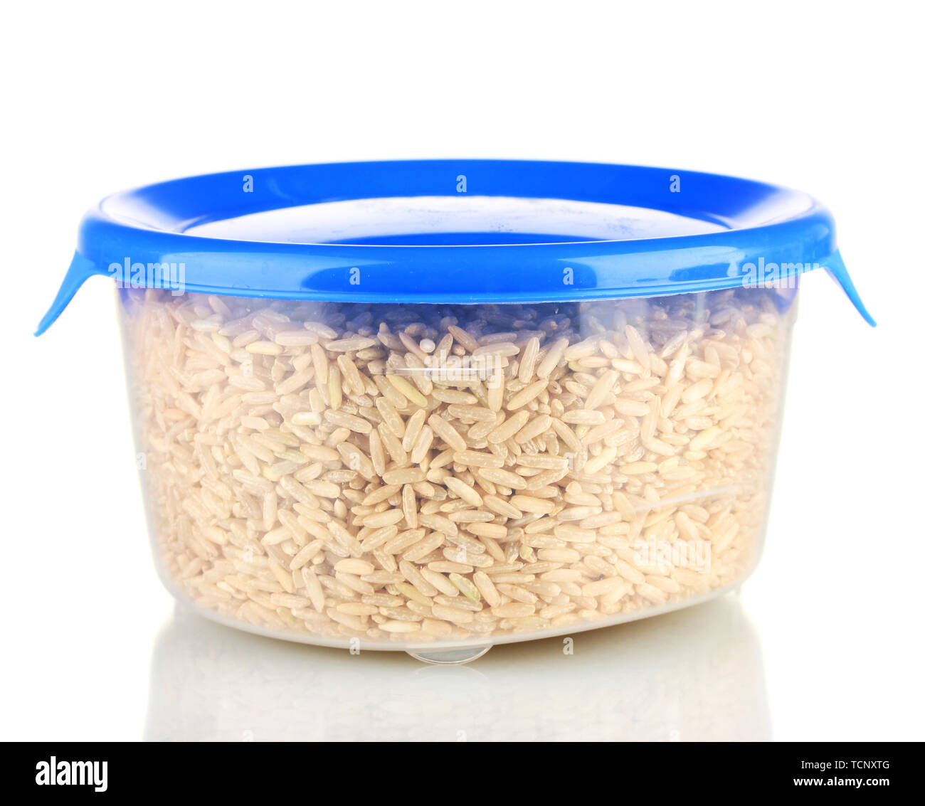 brown rice in jar on white background Stock Photo - Alamy