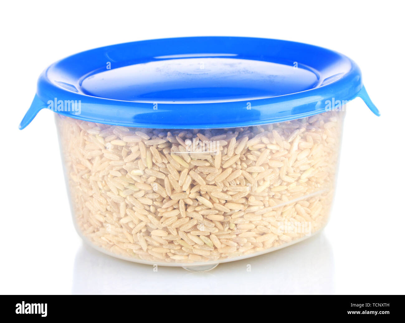 brown rice in jar on white background Stock Photo - Alamy