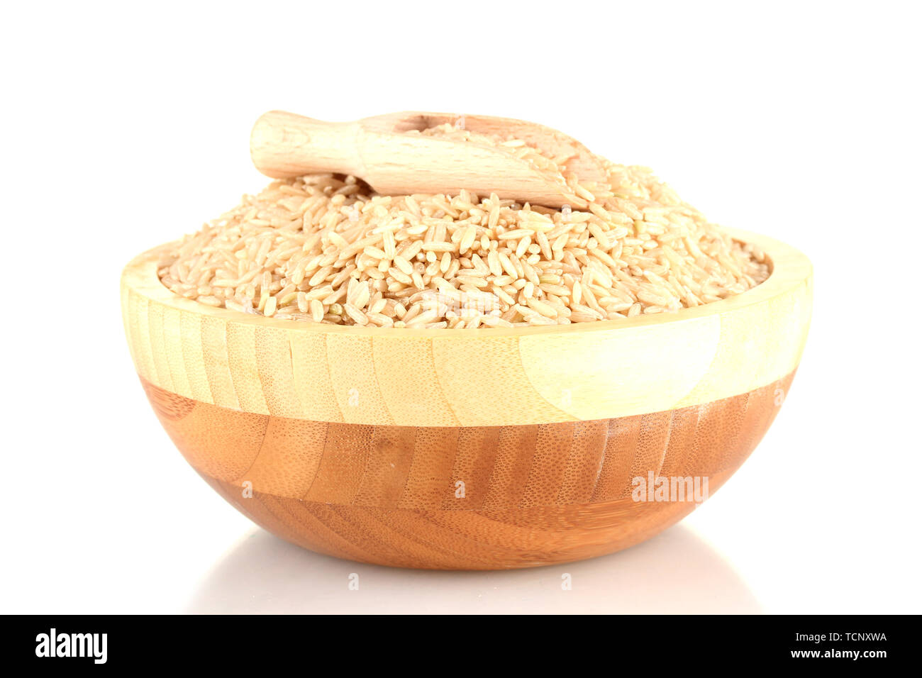 brown rice in a brown wooden plat, isolated on white Stock Photo - Alamy