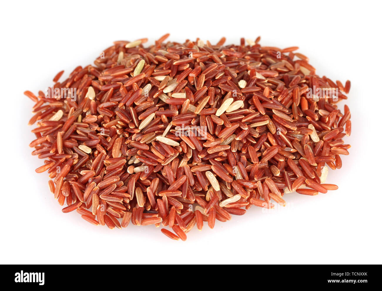 red rice uncooked in a heap isolated on a white background Stock Photo ...