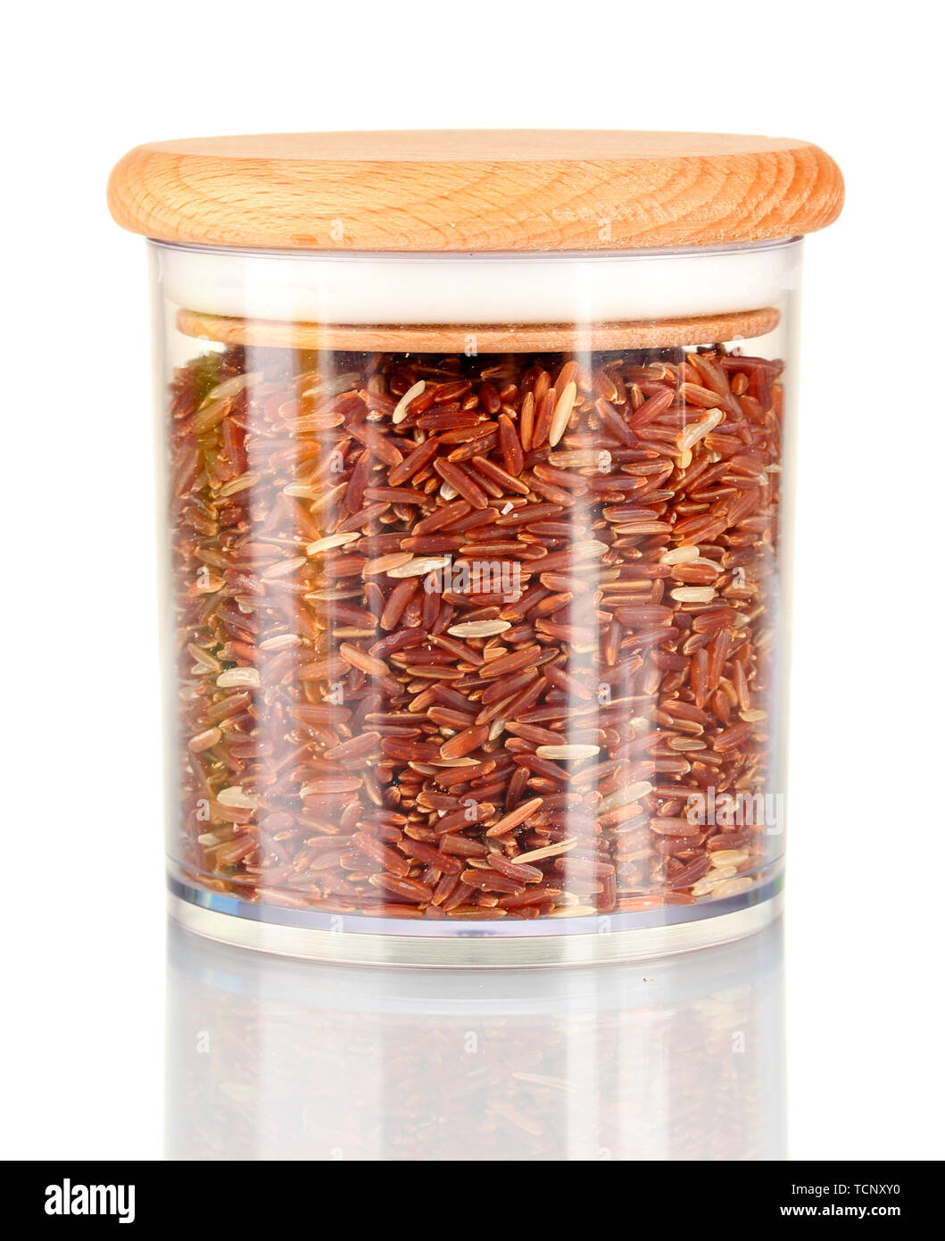 red rice in jar on white background Stock Photo - Alamy
