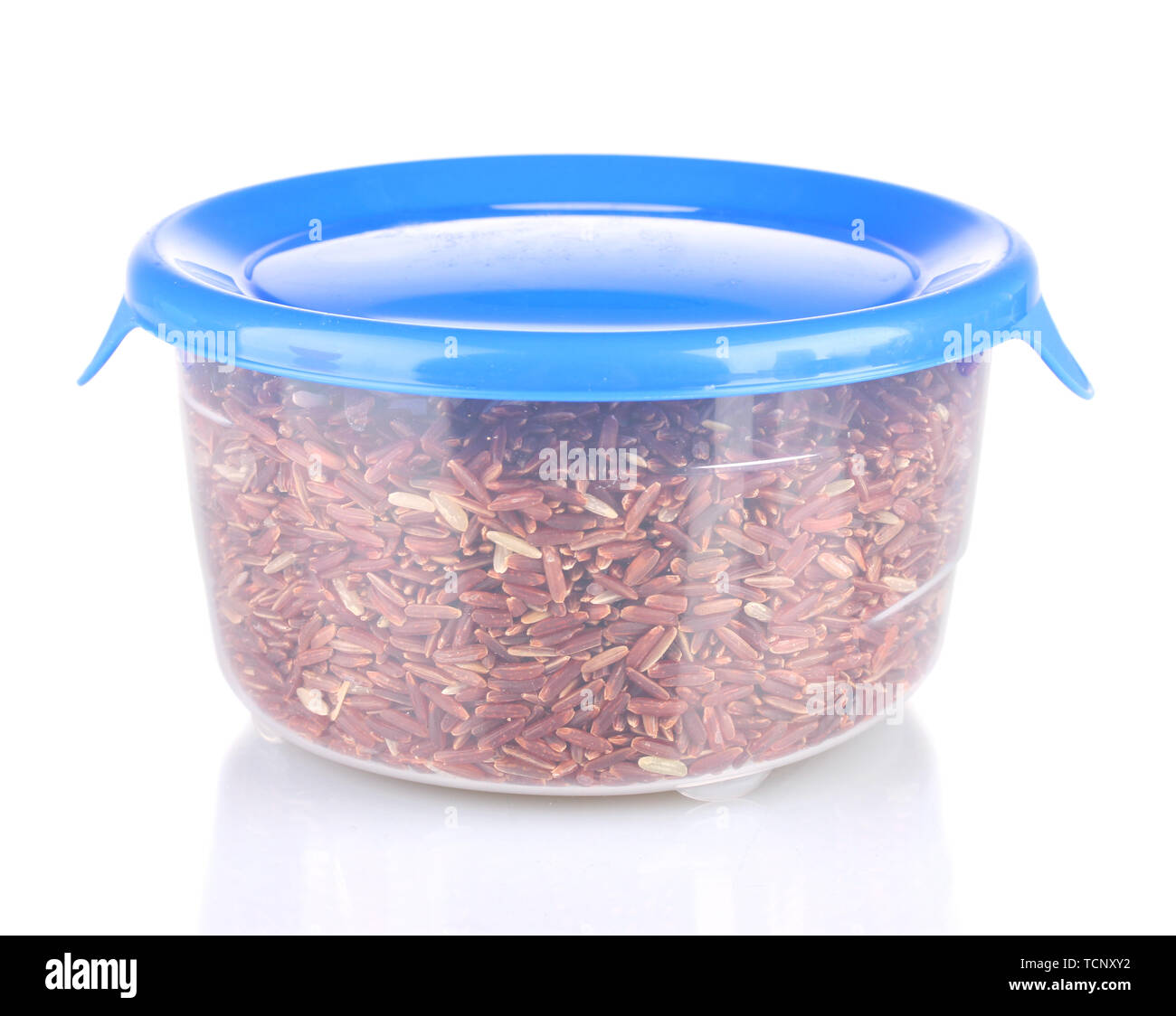 red rice in jar on white background Stock Photo - Alamy