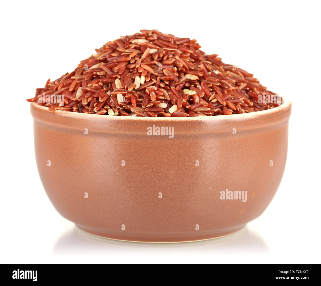 red rice in a brown plate , isolated on white Stock Photo - Alamy