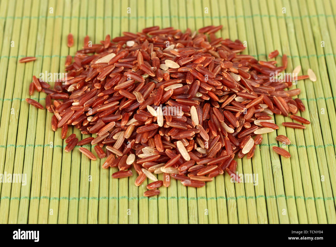 red rice on bamboo mat Stock Photo - Alamy