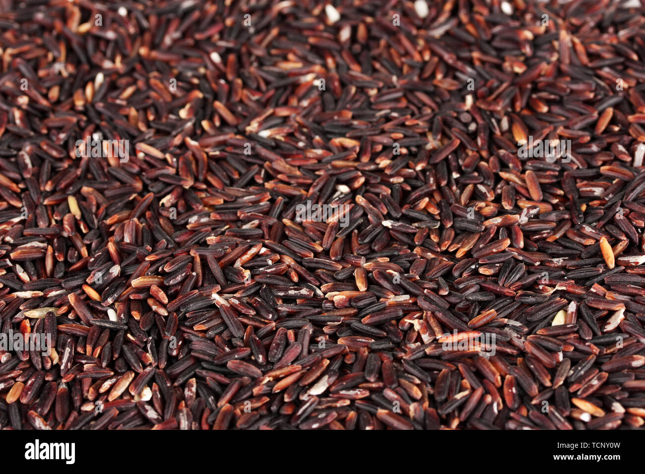 Background black rice Stock Photo - Alamy