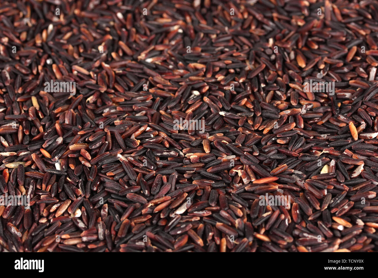Background black rice Stock Photo - Alamy