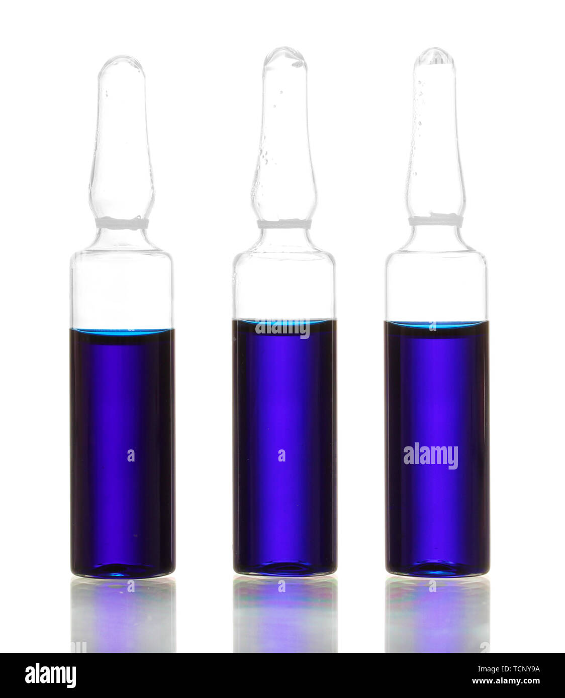 medical ampules with blue liquid, isolated on white Stock Photo - Alamy