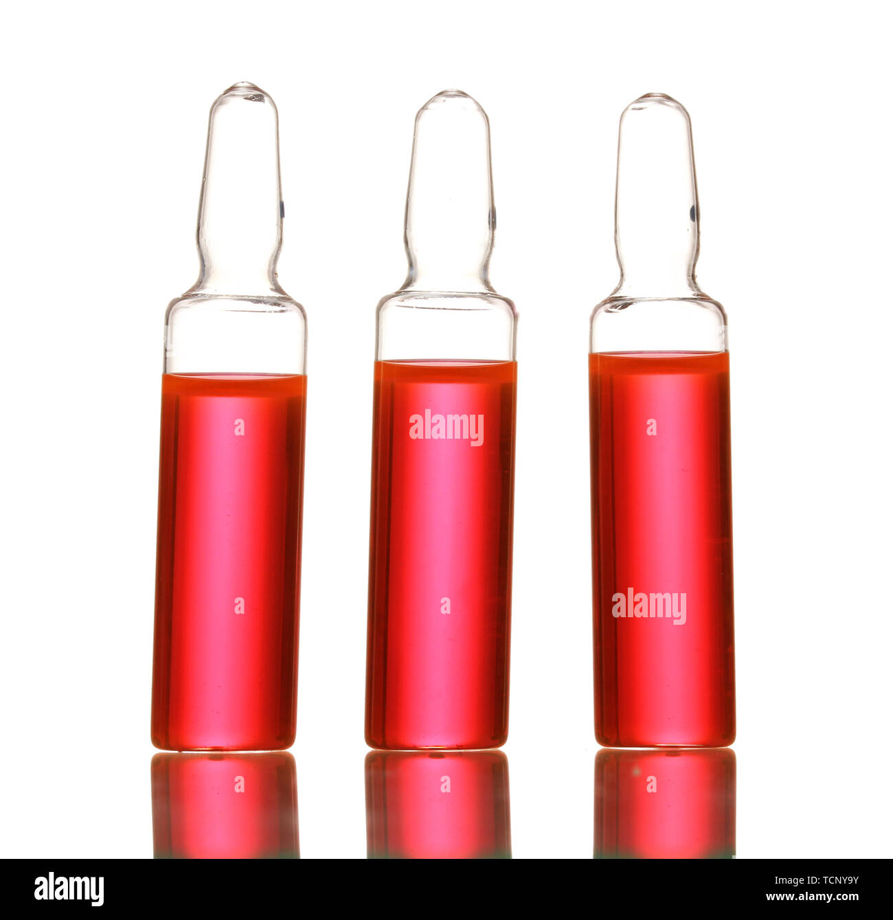 medical ampules with red liquid, isolated on white Stock Photo - Alamy