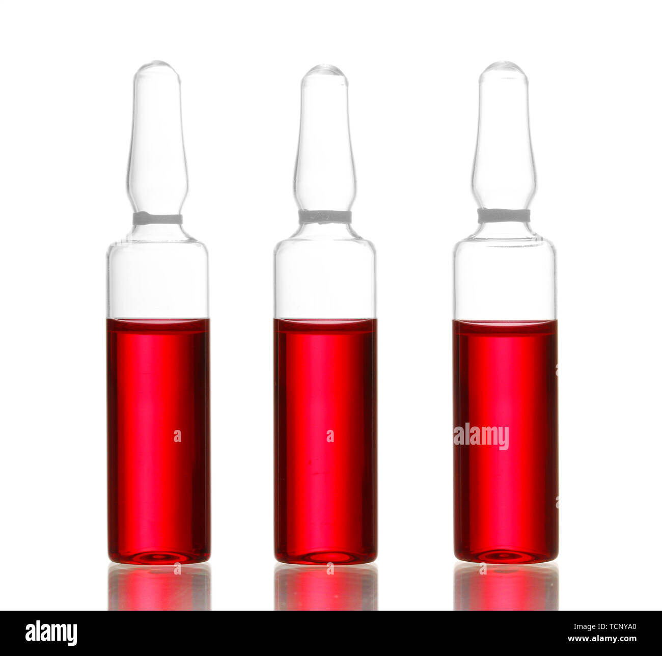 medical ampules with red liquid, isolated on white Stock Photo - Alamy