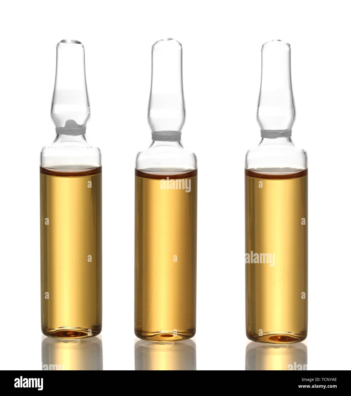 medical ampules with yellow liquid, isolated on white Stock Photo - Alamy