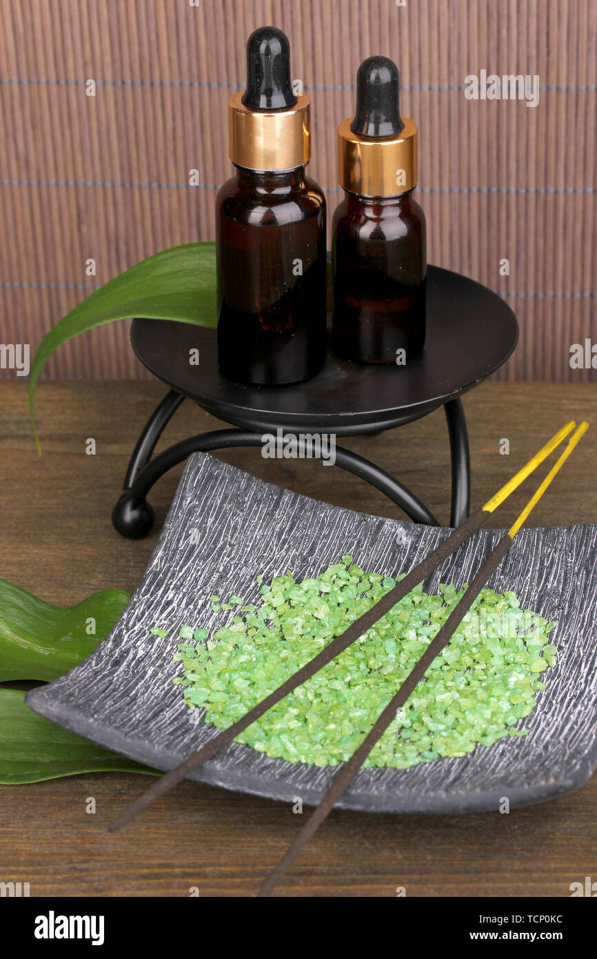 aromatherapy setting on brown bamboo background Stock Photo - Alamy