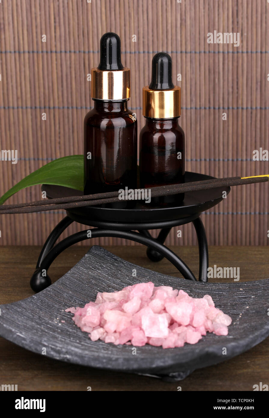 aromatherapy setting on brown bamboo background Stock Photo - Alamy