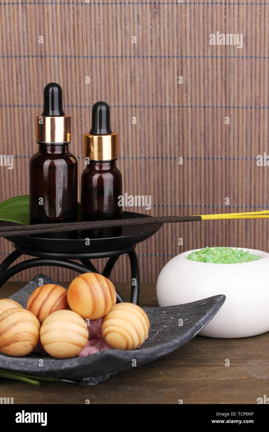 aromatherapy setting on brown bamboo background Stock Photo - Alamy