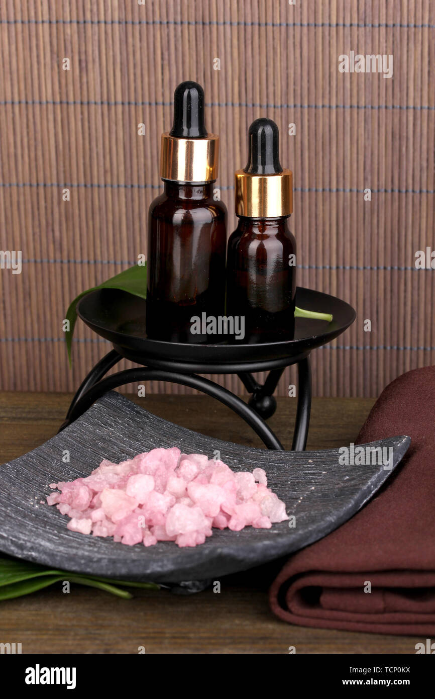 aromatherapy setting on brown bamboo background Stock Photo - Alamy