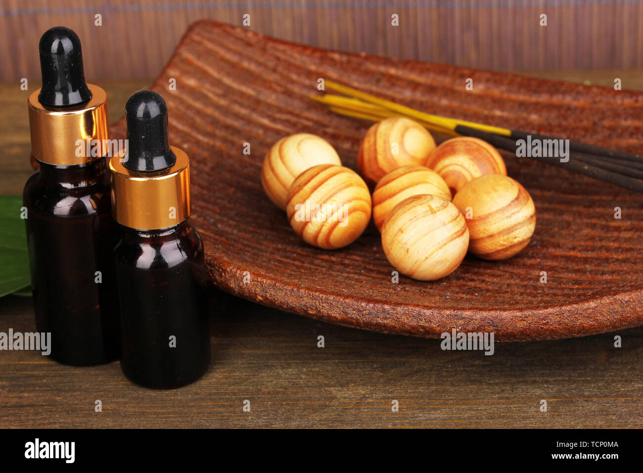 aromatherapy setting on brown bamboo background Stock Photo - Alamy
