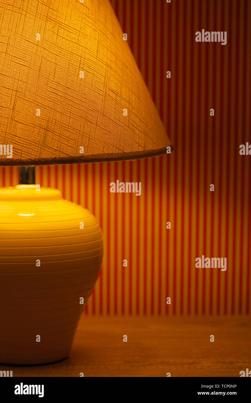 table lamp on wallpaper background Stock Photo - Alamy