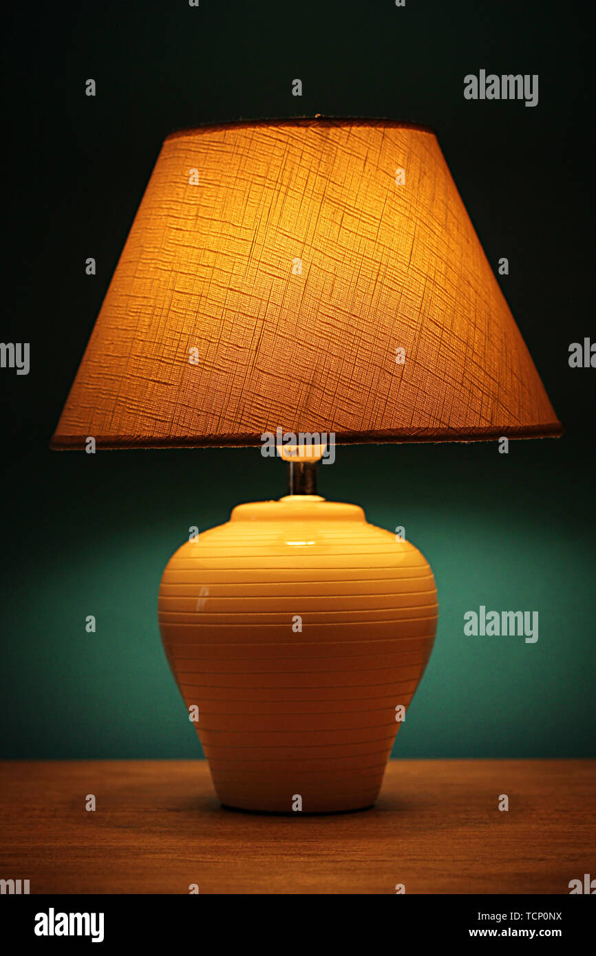 table lamp on wallpaper background Stock Photo - Alamy