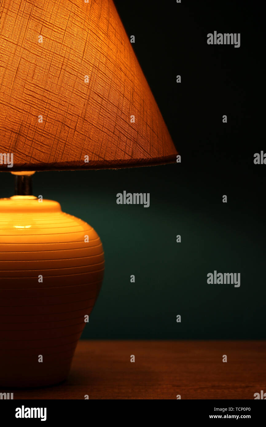 table lamp on wallpaper background Stock Photo - Alamy