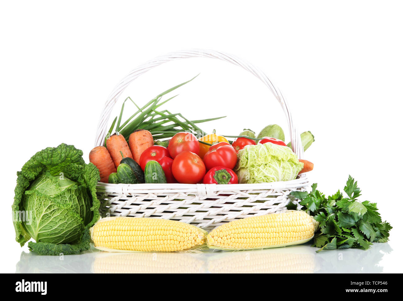 Composition with vegetables in wicker basket isolated on white Stock ...