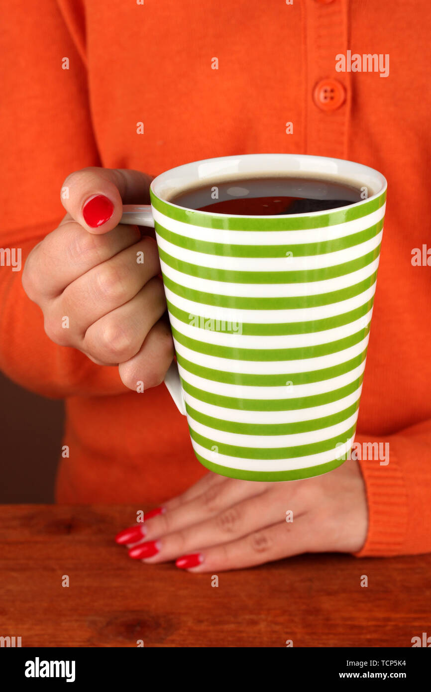 hands holding mug of hot drink, close-up Stock Photo - Alamy