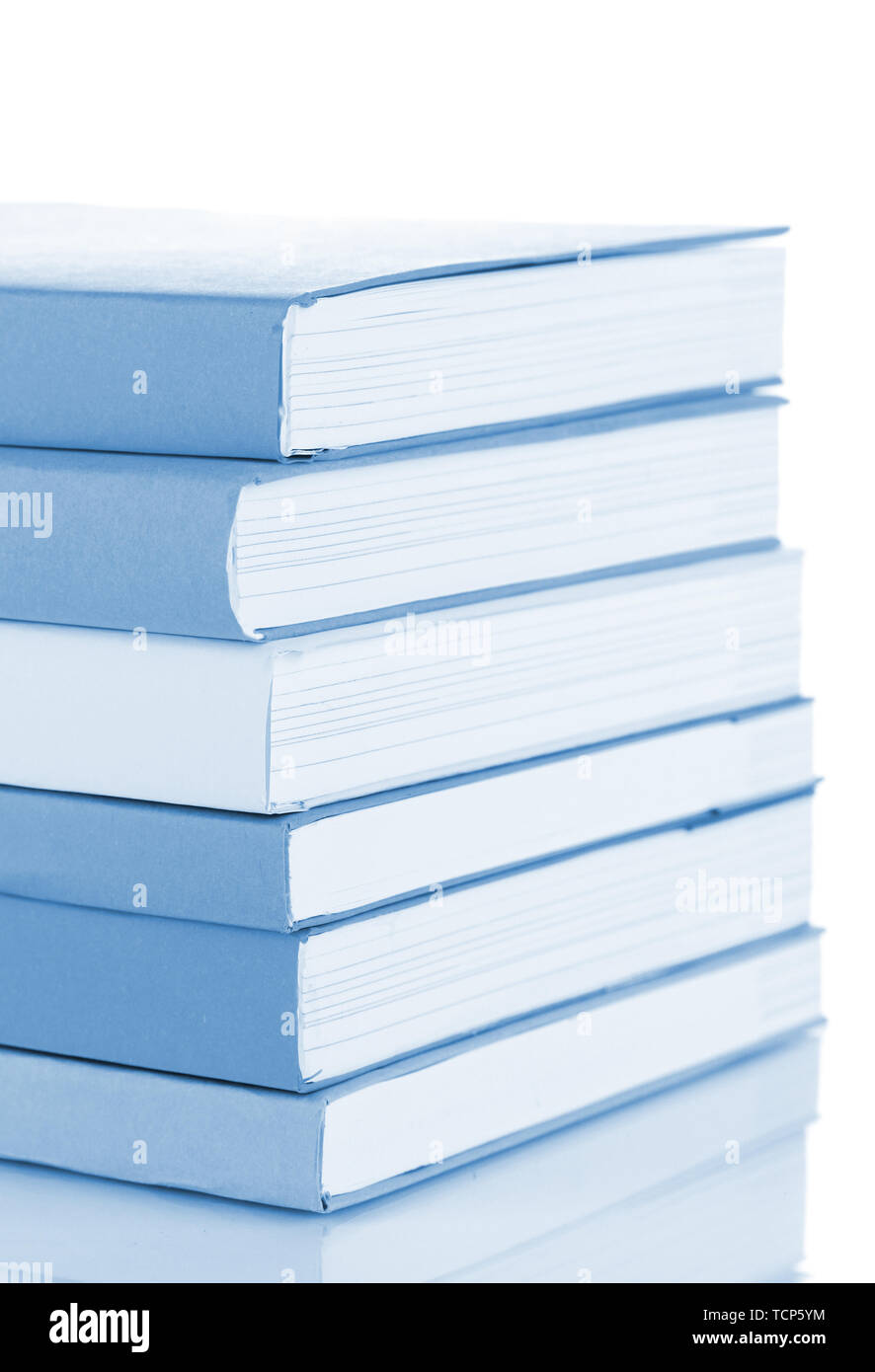 Stack of books in blue light Stock Photo - Alamy