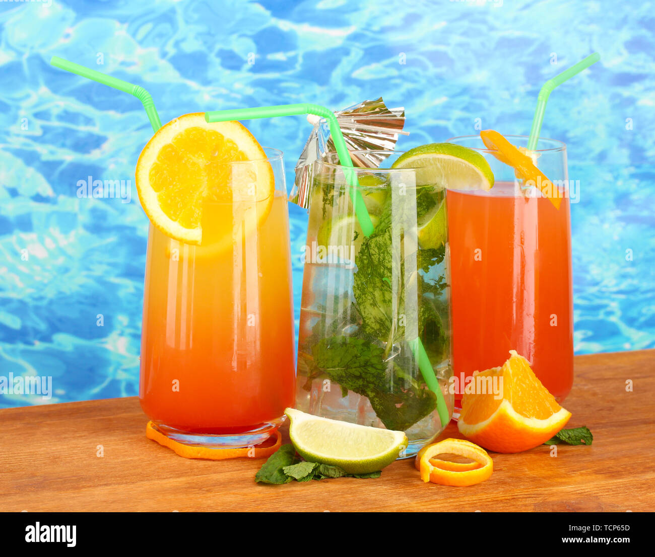 Three coctails on blue background Stock Photo - Alamy