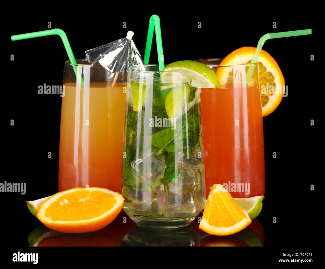 Three cocktails isolated on black Stock Photo - Alamy