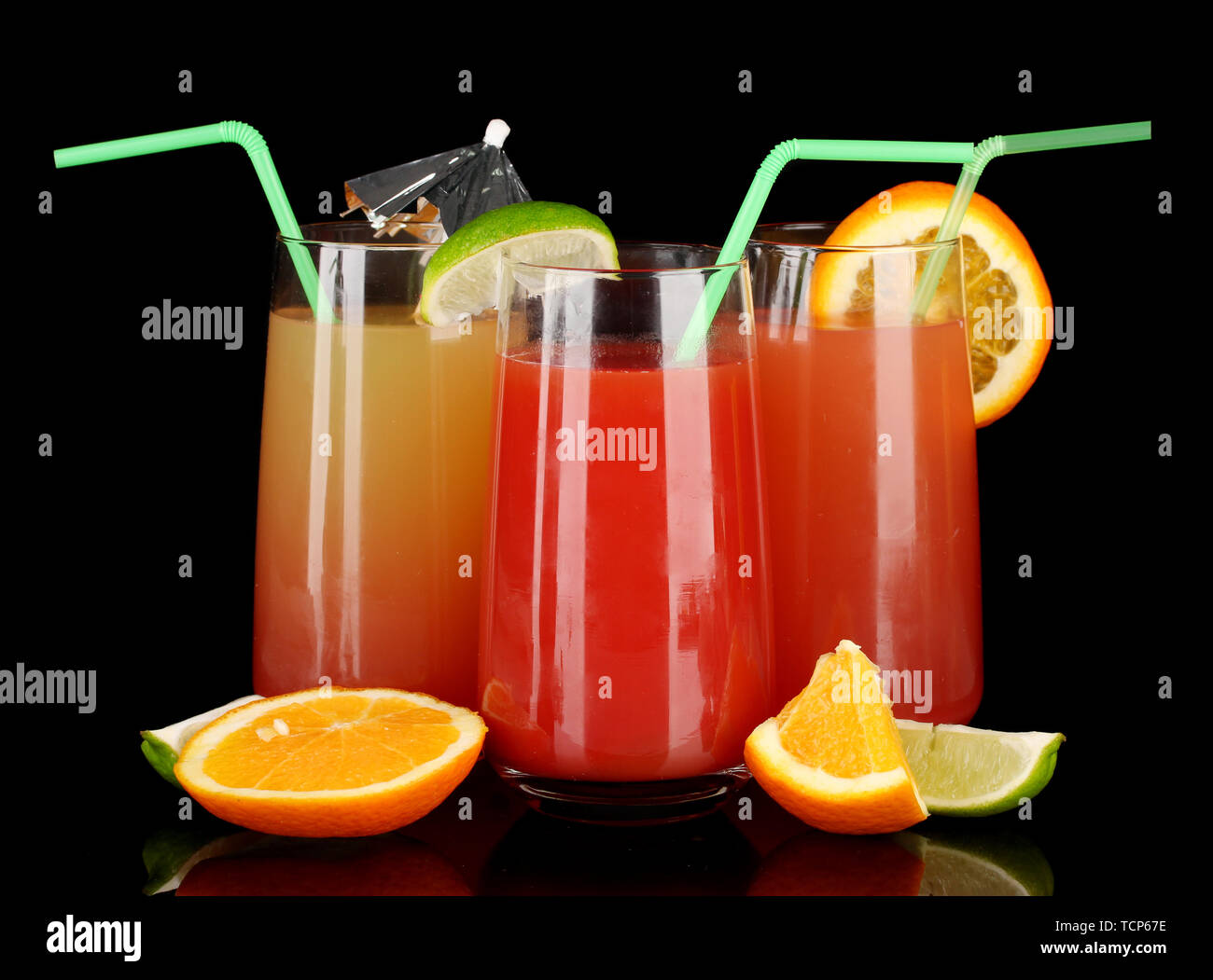 Three cocktails isolated on black Stock Photo - Alamy