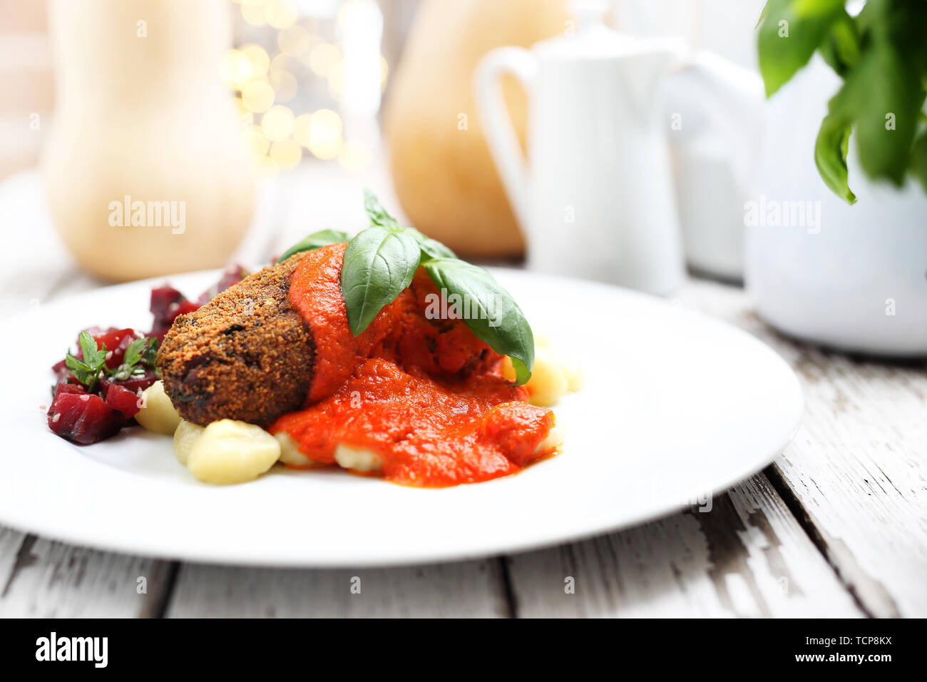 Appetizing dinner dish, vegetarian dish served on a white plate ...