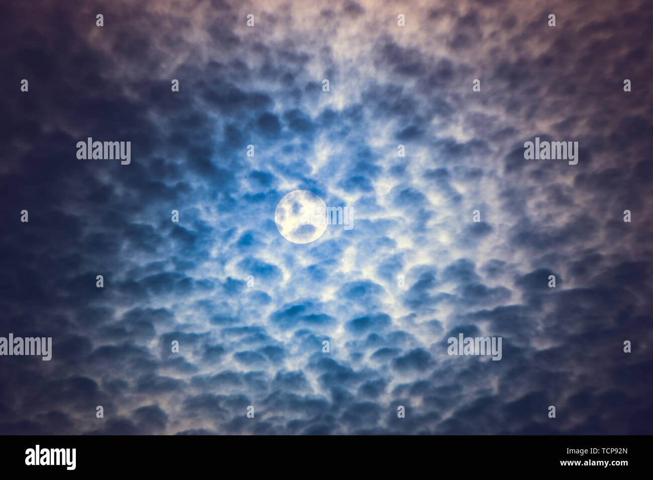 The cold moon is in the sky, the black clouds top, cover the sun Stock ...