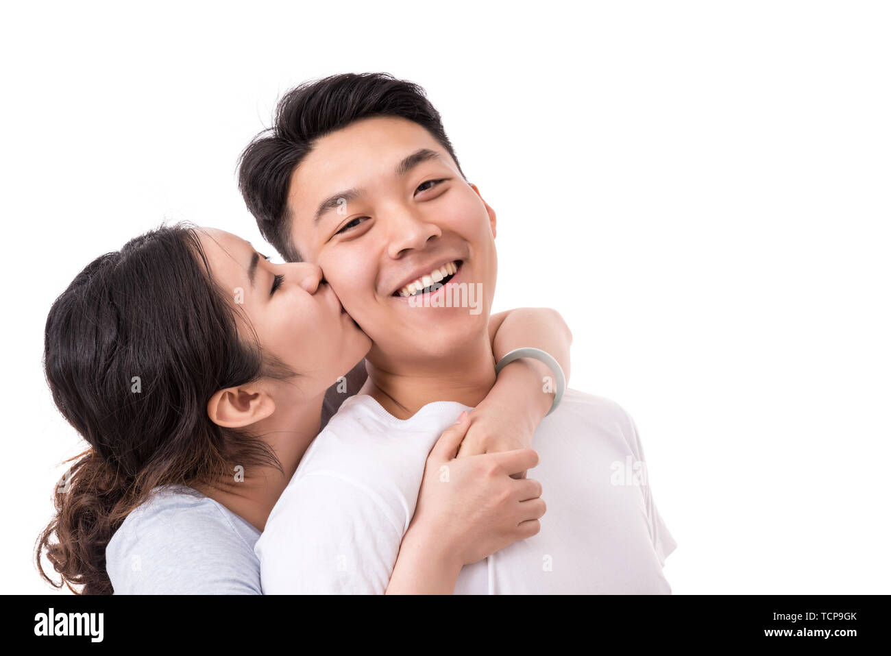 Happy man kissed by his girlfriend Stock Photo - Alamy