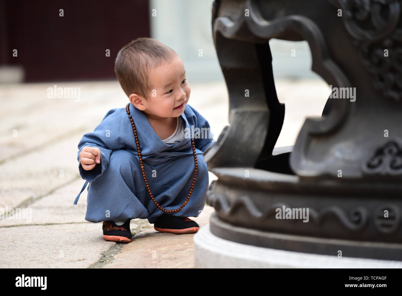 Cute little monk, children's photography Stock Photo - Alamy