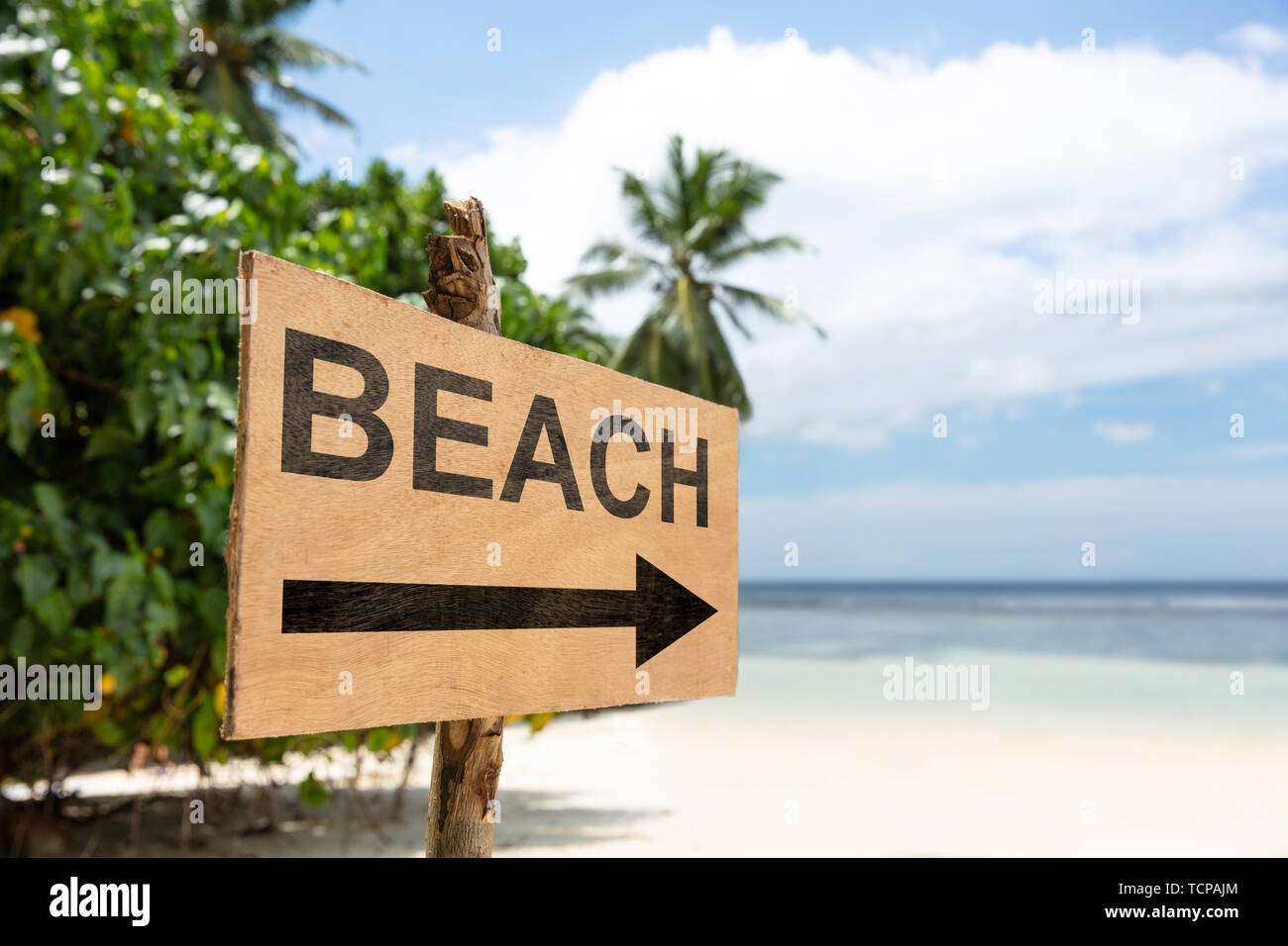 Beach Directional Sign Pole On Sand In Front Of Idyllic Sea Stock Photo ...