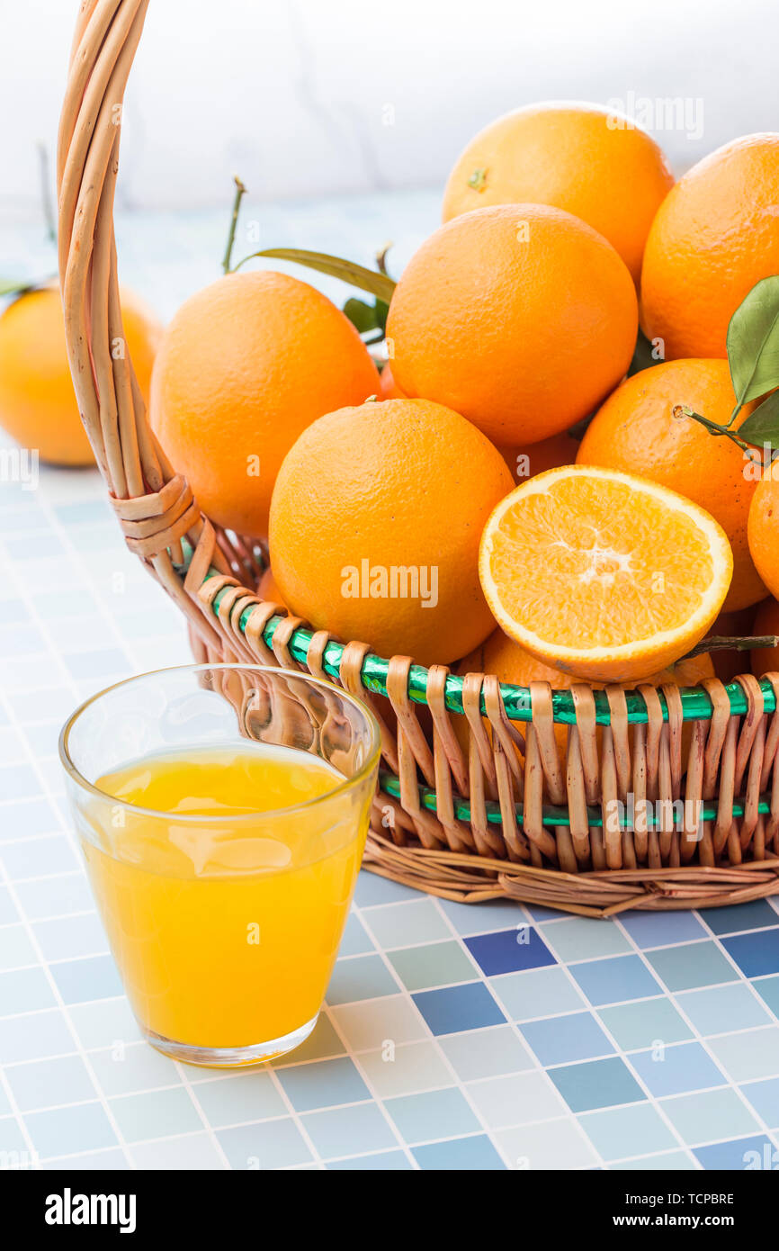 Fresh delicious oranges with orange juice Stock Photo - Alamy