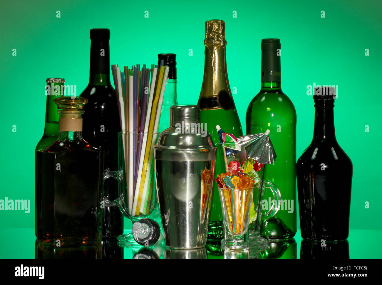 Collection of drinks, cocktail shaker and other bartender equipment on ...