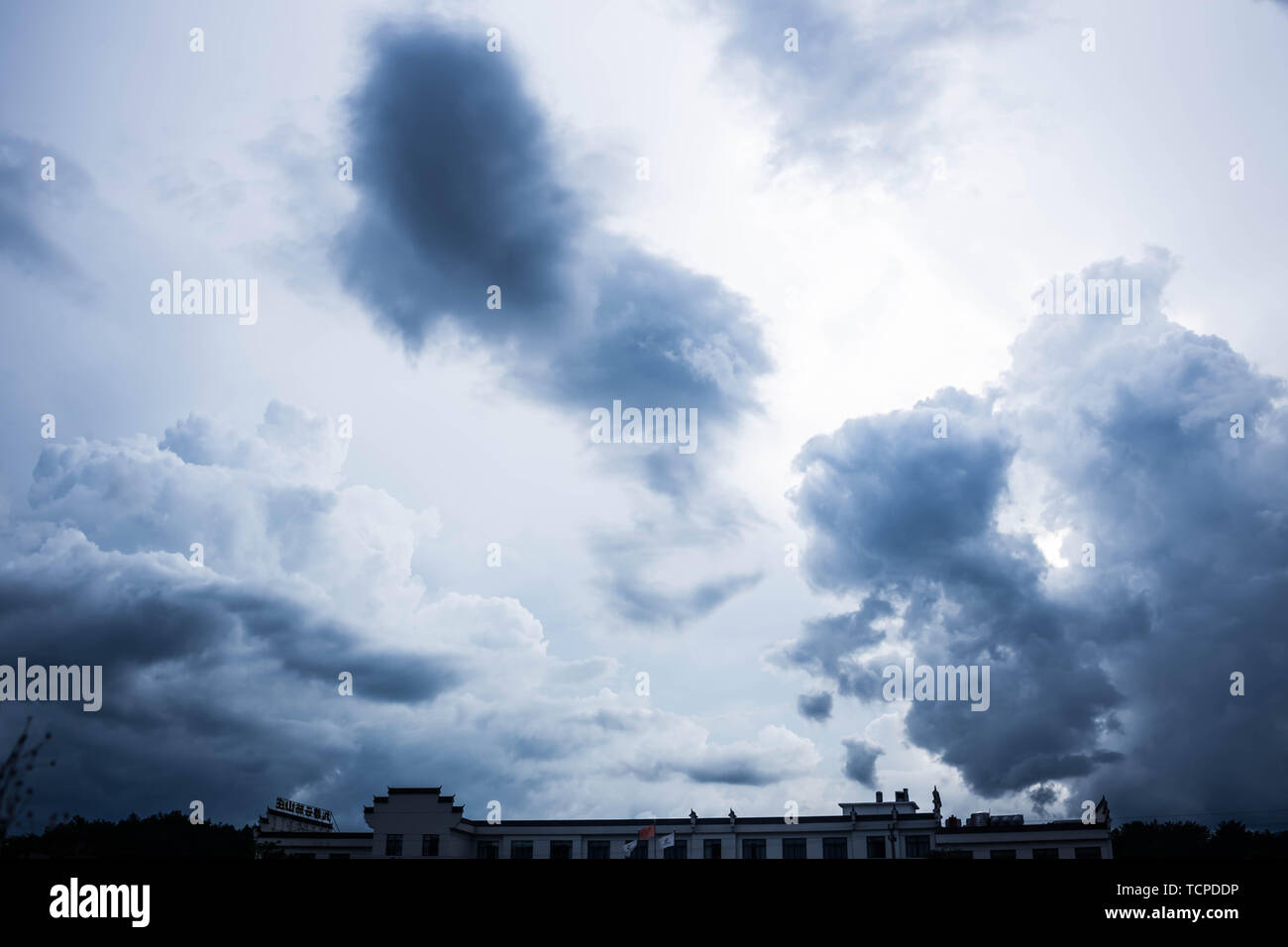 The wind rises and the clouds roll up Stock Photo - Alamy
