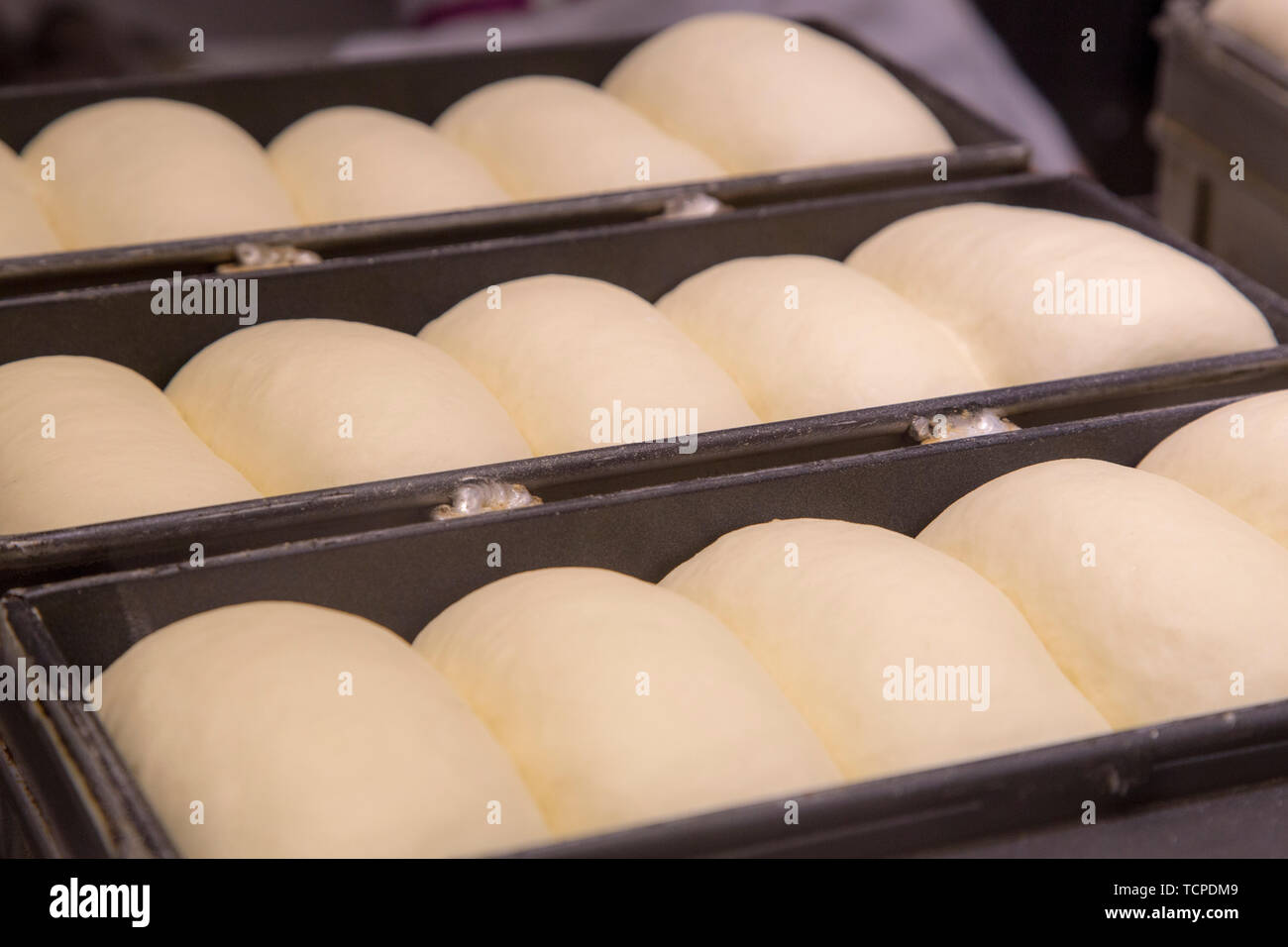 Bread baking close-up Stock Photo - Alamy