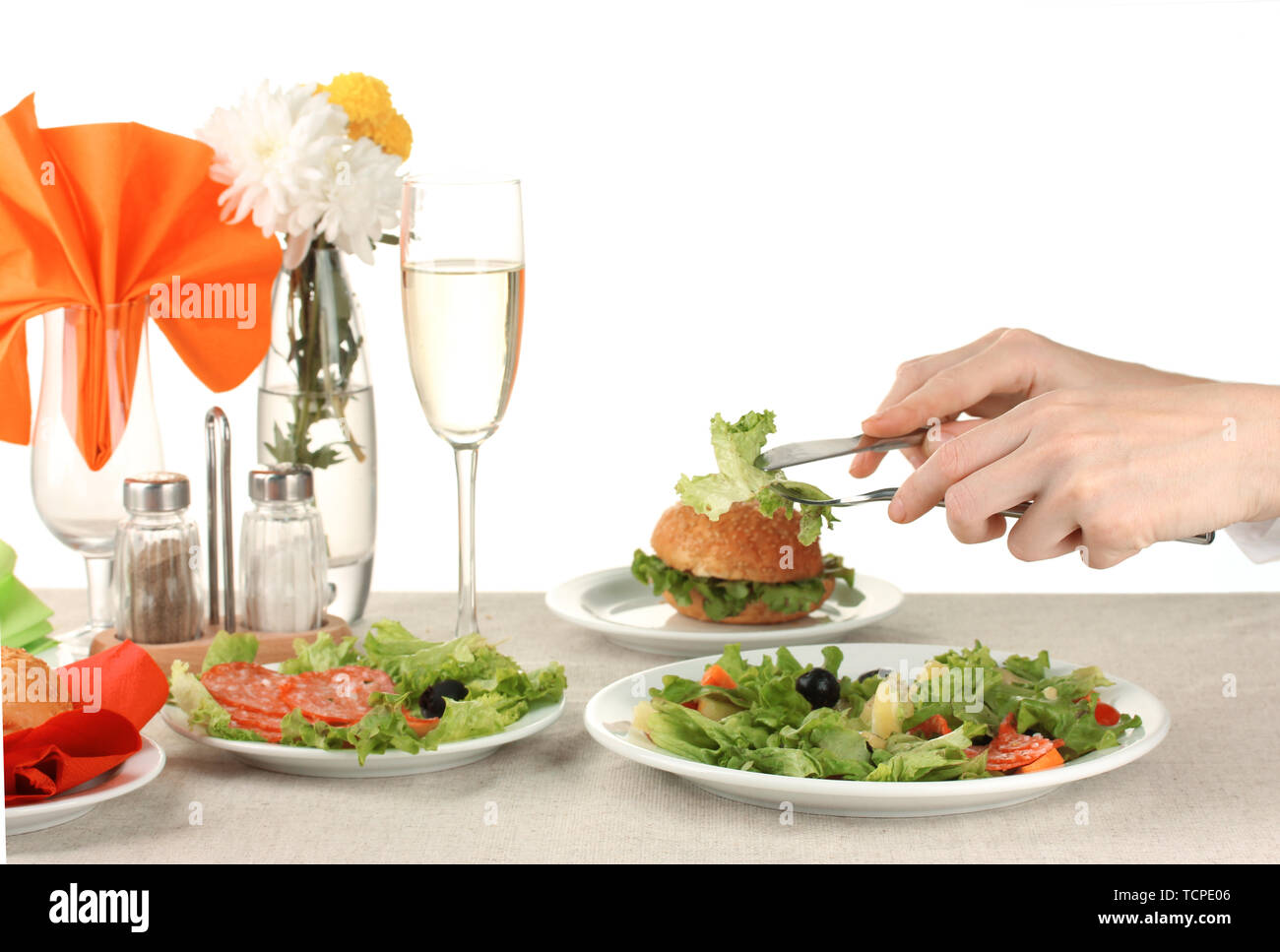 Female hand with dinner isolated on white Stock Photo - Alamy