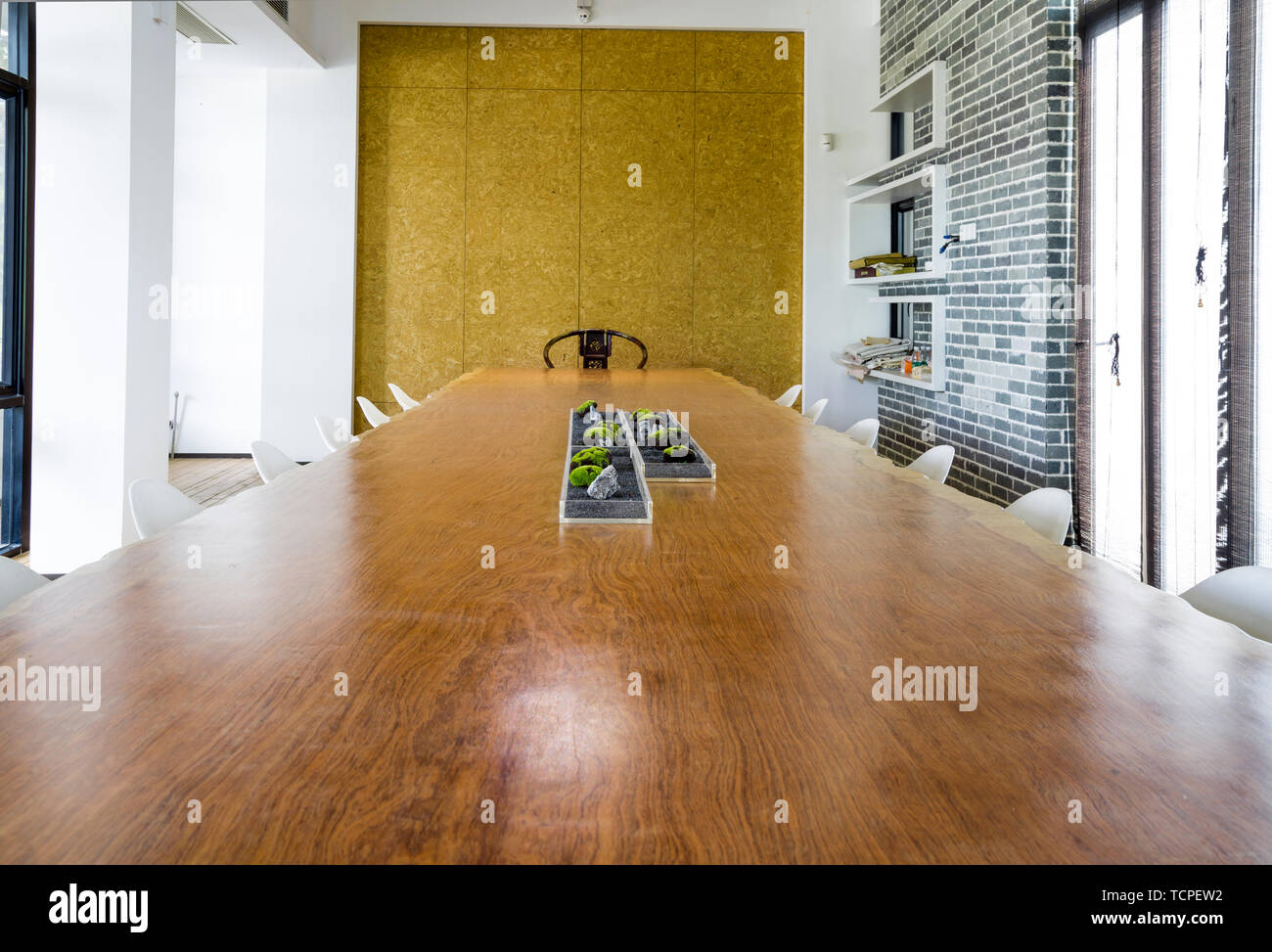 Long table in room room Stock Photo - Alamy